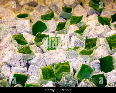 Traditional turkish delight (rahat lokum) in white ceramic plate with ...