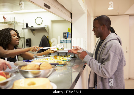 Homeless people waiting for food in front of the general post office ...