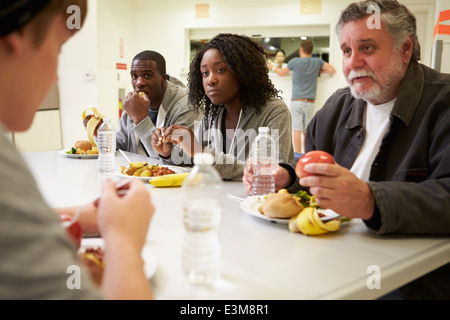Homeless people waiting for food in front of the general post office ...