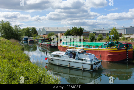 Derelict barges and present day industry on and alonside the bank of ...