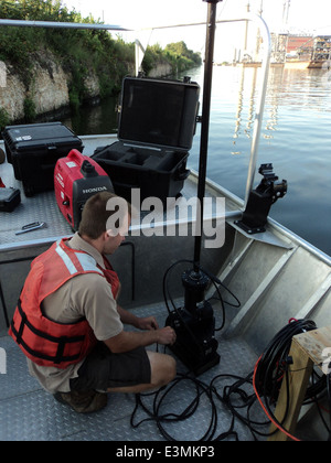 The DIDSON (Dual-Frequency Identification Sonar) system is set up to ...