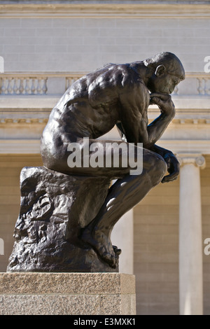 A bronze sculpture titled "The Thinker" by Auguste Rodin rests in the ...