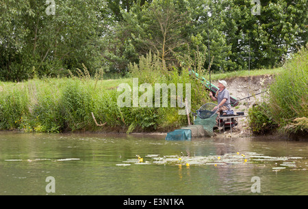 Angler angling, the River Thames at Wallingford, Oxfordshire England UK ...
