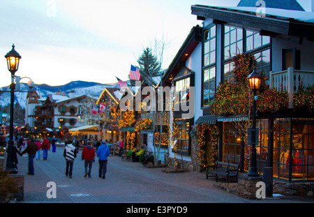 Vail Colorado town in winter time with Christmas lights and flags on ...