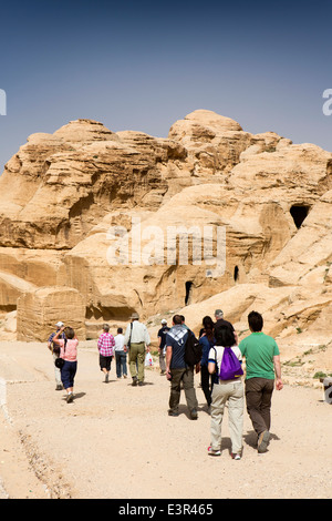 Jordan, Arabah, Petra, tourists walking on road to Grand Temple of ...