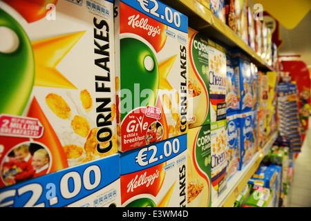 Packets of Kellog's Cornflakes breakfast cereal focused on front box ...