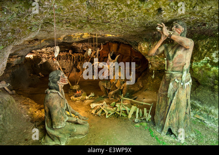 Prehistoric Cro-Magnon shamen and woman in cave at Grottes du Roc de ...
