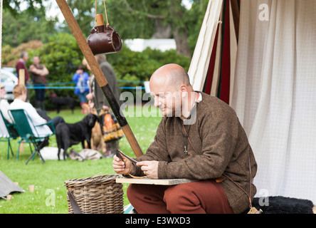 Fletching. A fletcher making an arrow. Making an arrow flight Robin ...