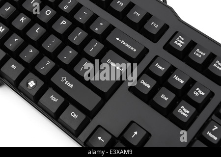 Computer keyboard. Black keyboard with a cord on a white background ...