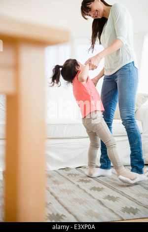 Two women mother and daughter dancing at home Stock Photo - Alamy