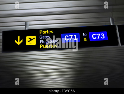 Airport sign, directing to gates Stock Photo - Alamy