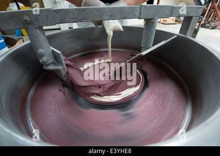 Polyester body filler mixed in a machine Stock Photo - Alamy