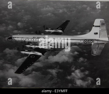 A photograph of the Canadair CL-44 aircraft over the Pré-Clau Bridge ...