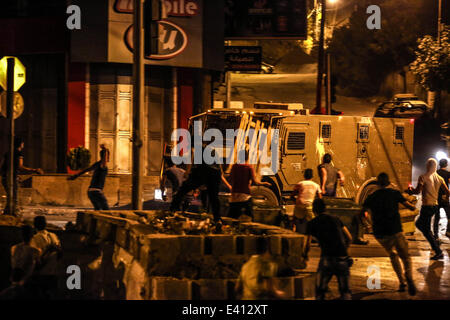 Nablus City, West Bank. 2nd July, 2014. Palestinian protesters threw ...