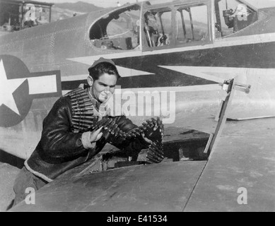 Cpl. Judge Wilson loading guns onto the P-51-C, a significant aircraft ...