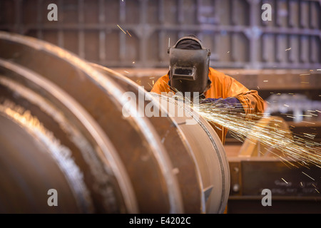 FACTORY WORKER GRINDING Stock Photo - Alamy