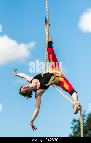 Rope acrobat performing Stock Photo - Alamy