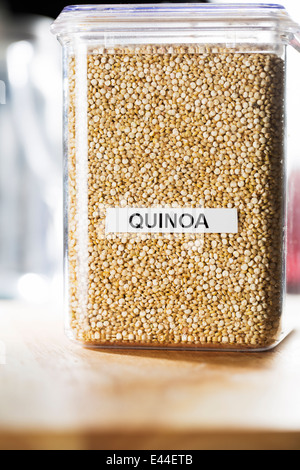 Quinoa in labeled container on counter Stock Photo - Alamy