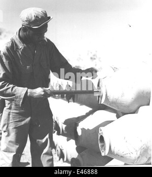 This image shows the loading of incendiary bombs, an important aspect ...