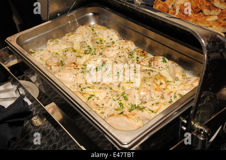 Caterer brought some delicious chicken for the wedding buffet dinner ...
