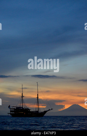 A traditional phinisi boat sailing on Segah river in Tanjung Redeb ...