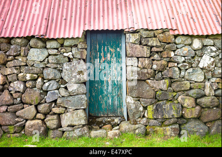 Old barn interior in the village. Vintage shed built of wood and brick ...