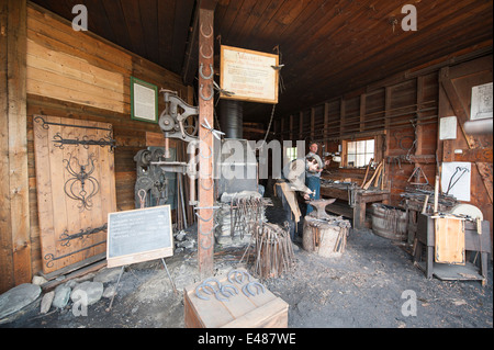 Interior of a wild west blacksmith shop adorned with bridles and reins ...