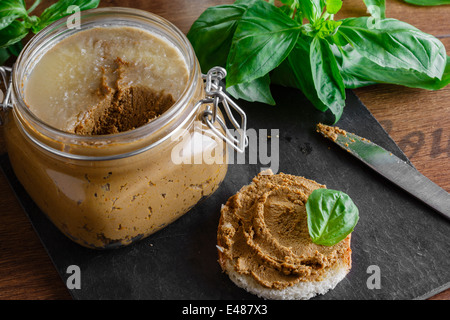 Glass jar with delicious liver pate on white background Stock Photo - Alamy