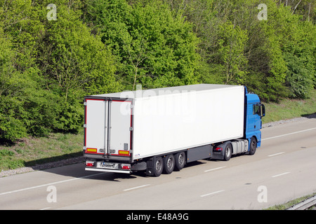 Rear view of an unmarked foreign truck traveling along the M20 Stock ...