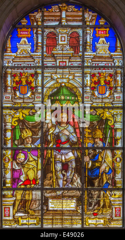 A stained glass window depicting Archangel Michael slaying Satan after ...
