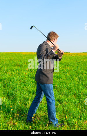 business people holding a golf club Stock Photo - Alamy