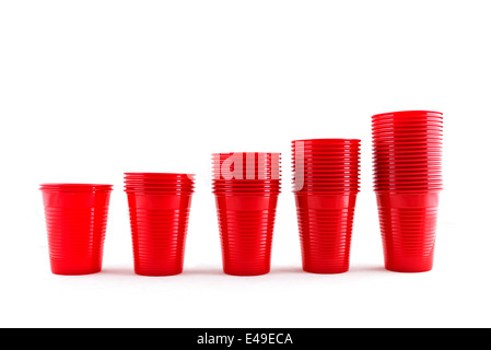 Plastic red cups stacks isolated on white background Stock Photo - Alamy