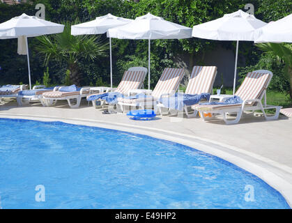 beautiful swimming pool with parasols and view to mountain Stock Photo ...