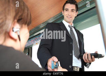 Tram conductor checking ticket Stock Photo - Alamy