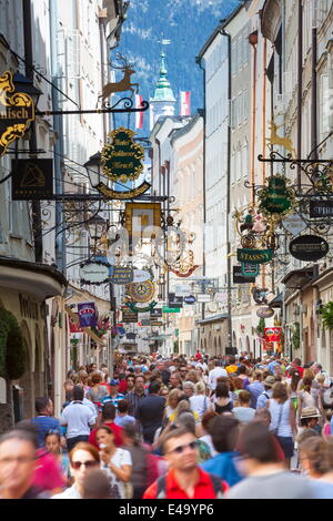 Ornate iron signs on a shopping street in the Altstadt, Salzburg ...