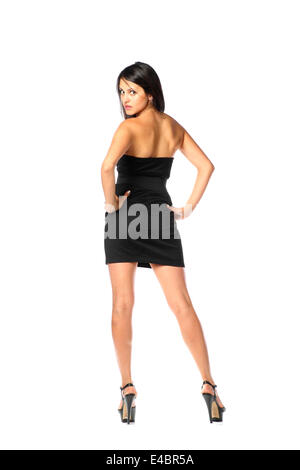 Portrait of business lady in black shirt with pen and paper, looking at ...