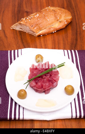 Tartar with bread on a plate Stock Photo - Alamy