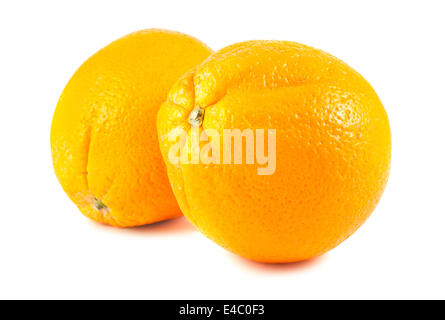 closeup the pair of ripe orange grapefruit hold hand over out of focus ...