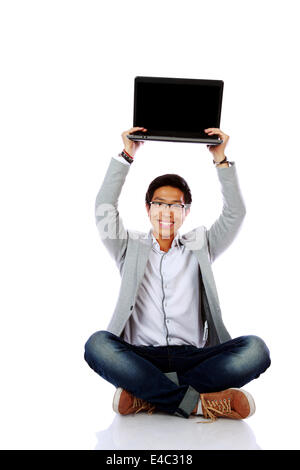 Chinese and Caucasian man sitting on grass with coats off Stock Photo ...