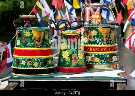 Painted Buckby cans on a narrowboat Stock Photo - Alamy