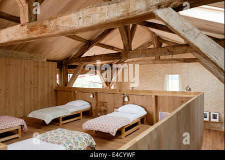 Converted open-plan barn with original timber supports, skylight and ...