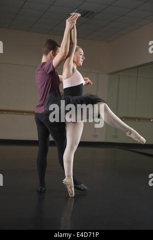 Ballet partners dancing gracefully together in the ballet studio Stock ...
