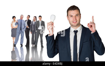 Businessman holding a light bulb with PARTNERSHIP inscription, new ...