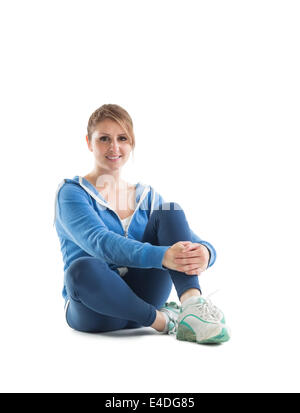 Portrait of young fit attractive happy fitness woman in city. People ...