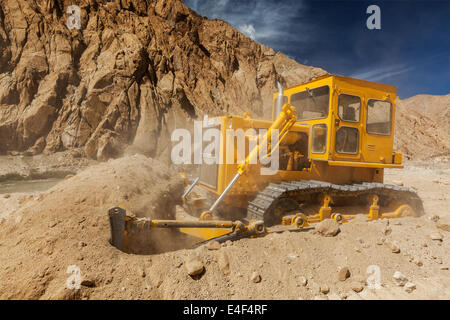 Bulldozer doing road construction in Himalayas Stock Photo - Alamy