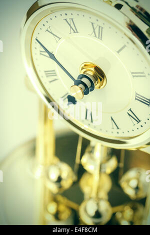 Period clock with oscillating mechanism Stock Photo - Alamy