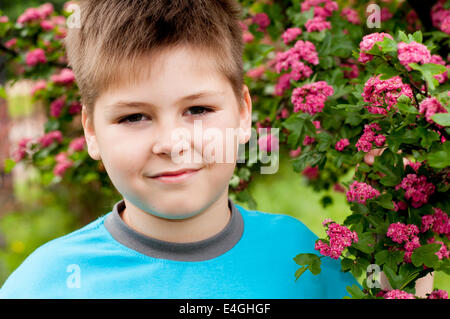 A boy near the a flowering tree Stock Photo - Alamy