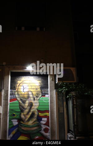 Rome, Italy 10th July 2014 Shop shutter adorned with World Cup trophy ...