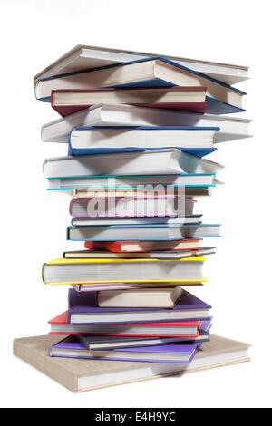 Tall stack of books, book tower with blank black covers but top book is ...