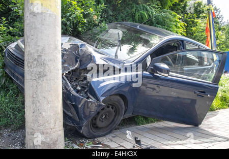 Crushed car in front collision traffic accident Stock Photo - Alamy